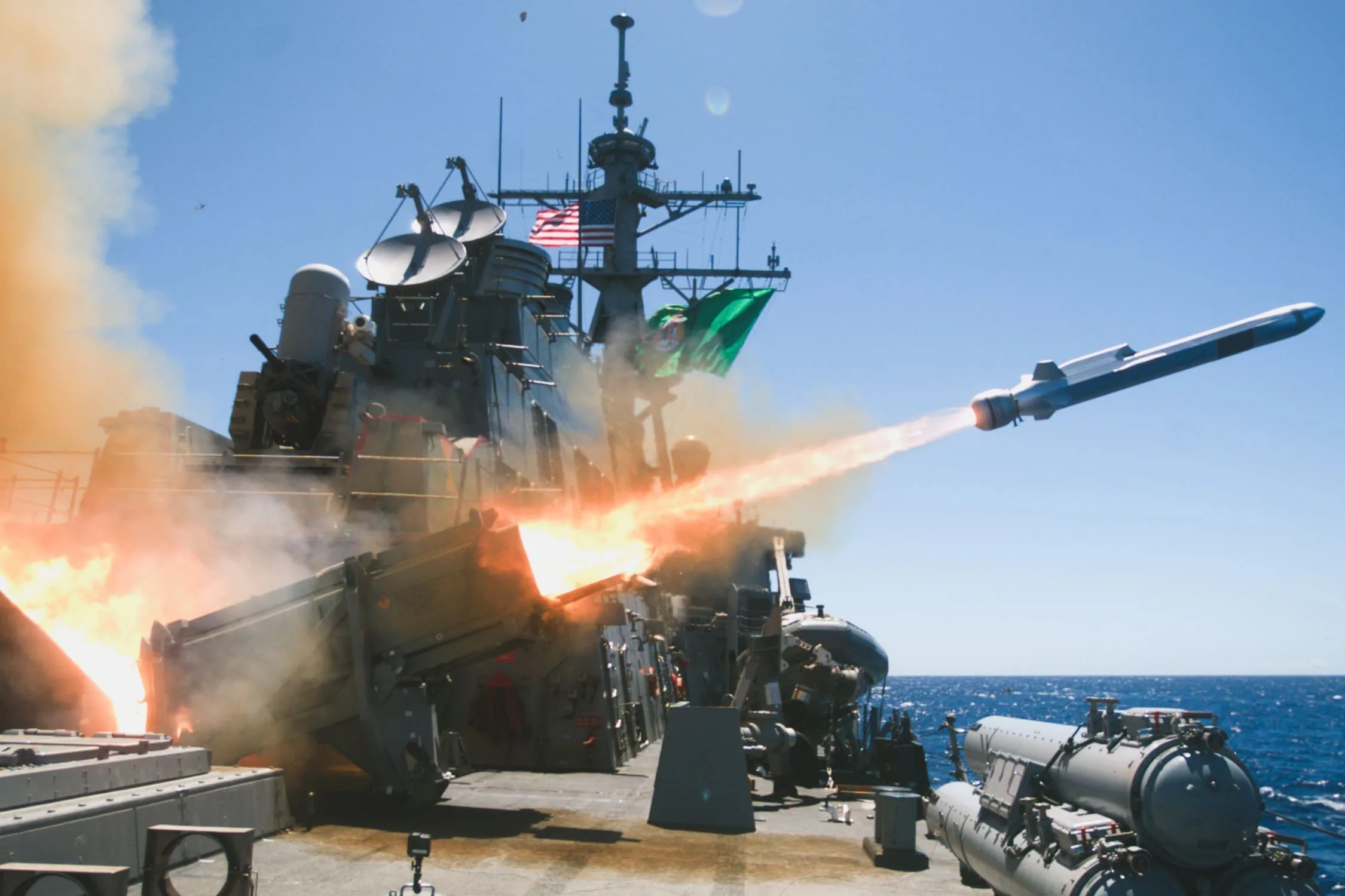 A U.S. Navy destroyer conducted the first over-the-horizon firing of ...